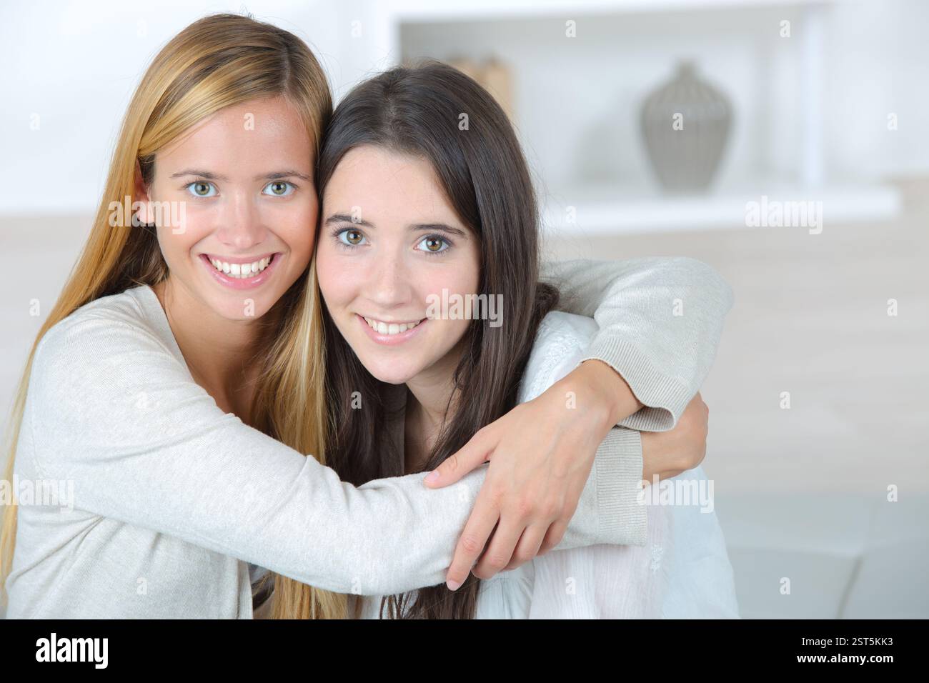 best friends are hugging in front of the camera Stock Photo - Alamy