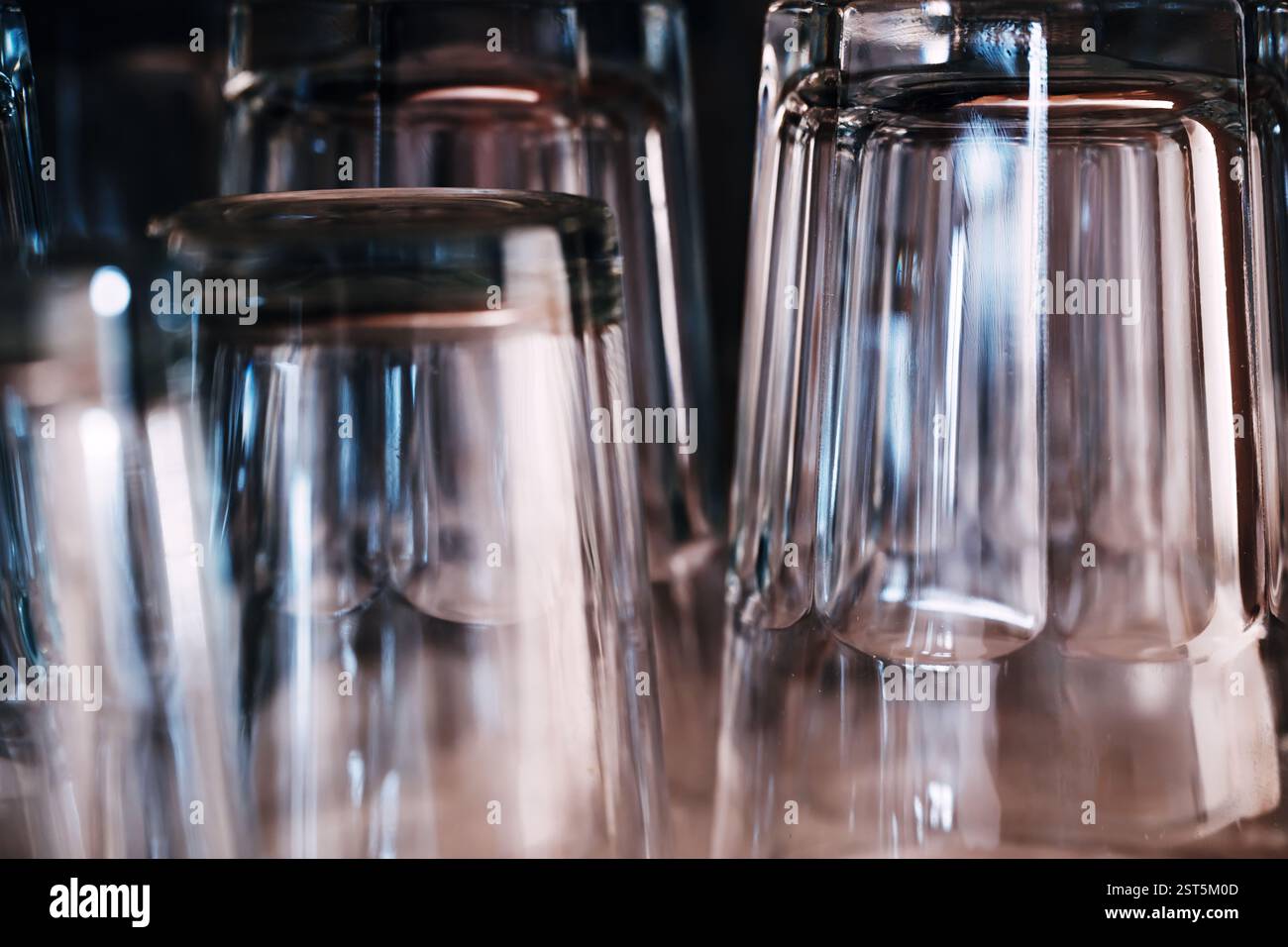 Set of empty clean drinking glasses on kitchen counter top after ...