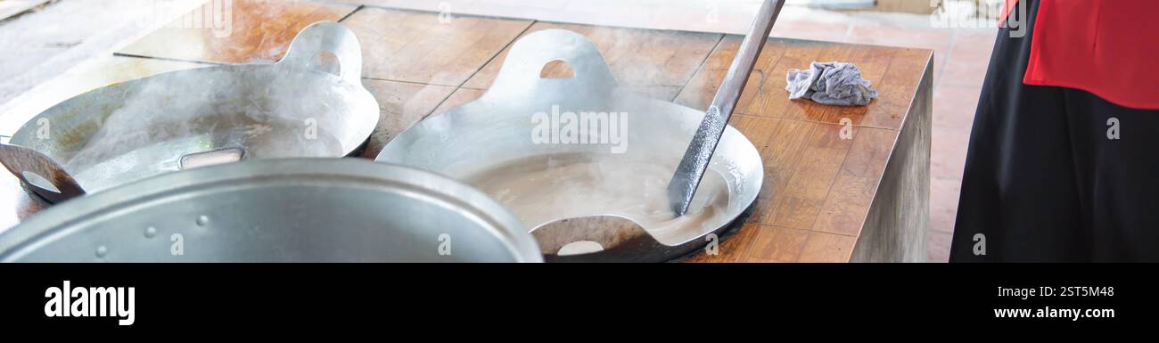 Panorama view lady hand using stick stir mixture of squeezed coconut ...