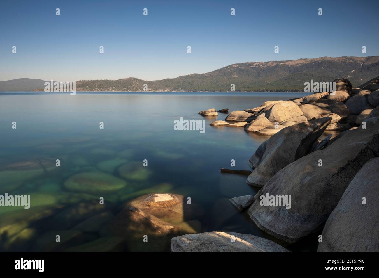 Lake Tahoe, California - Granite boulders under the clear blue to ...