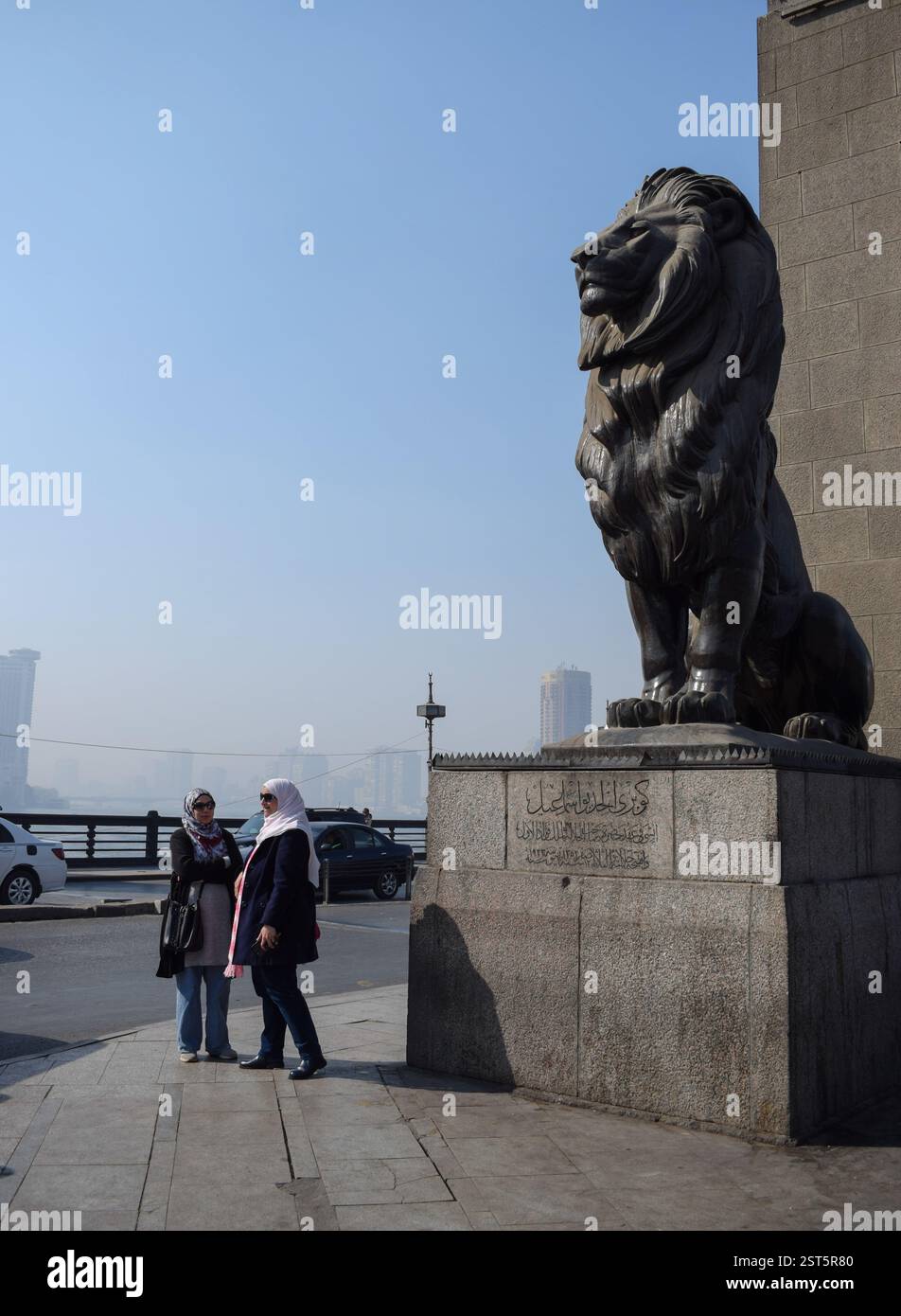 Cairo, Egypt, 17 February 2025. Passersby stand ahead of the bronze ...