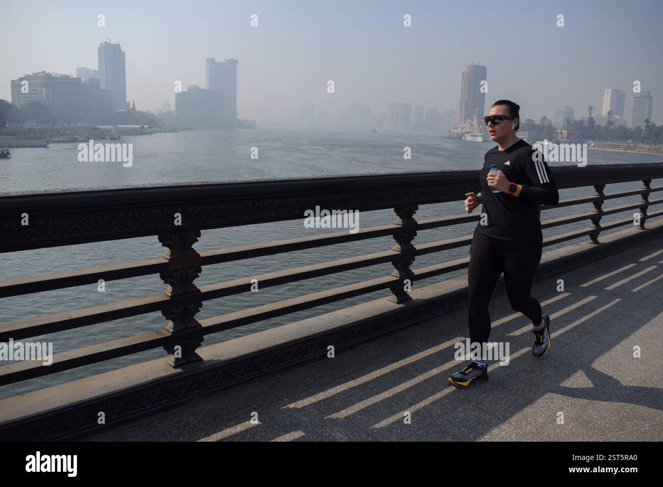 Cairo, Egypt, 17 February 2025. A woman is jogging at the Qasr El Nil Bridge. Credit: Dimitris ...