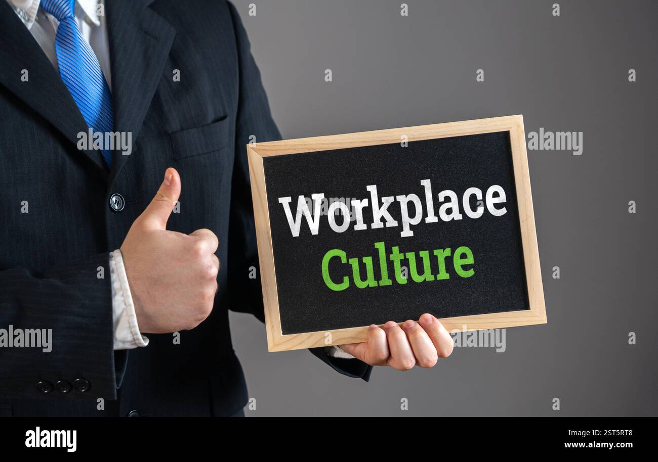 Businessman holding sign with Workplace Culture and giving thumbs up in ...