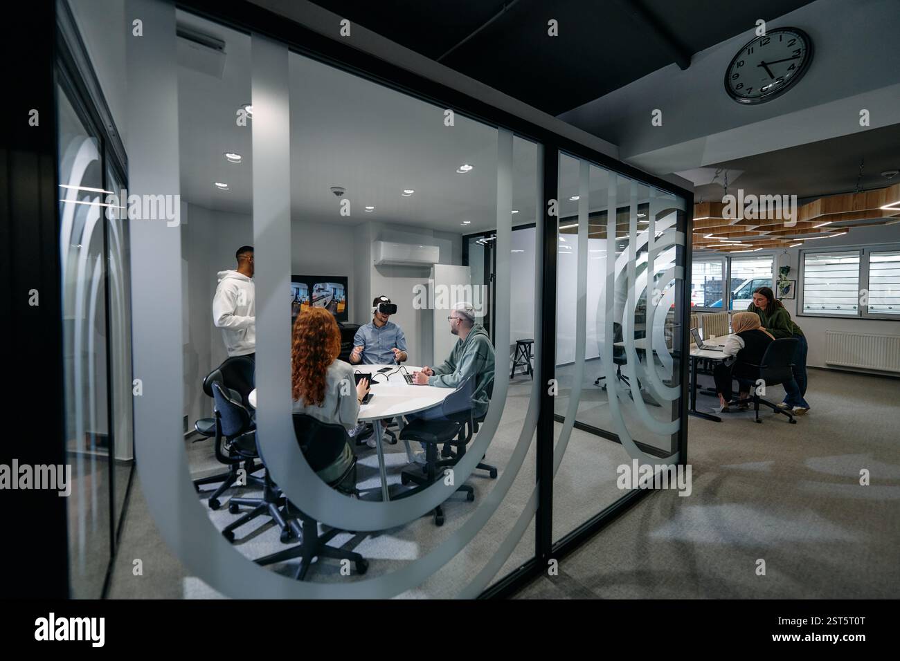 A diverse group of businessmen collaborates and tests a new virtual ...