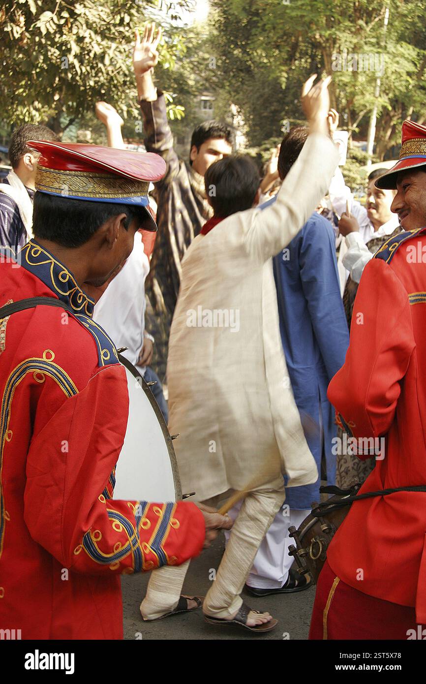 Celebrating by dancing in Indian Gujarati wedding procession called ...