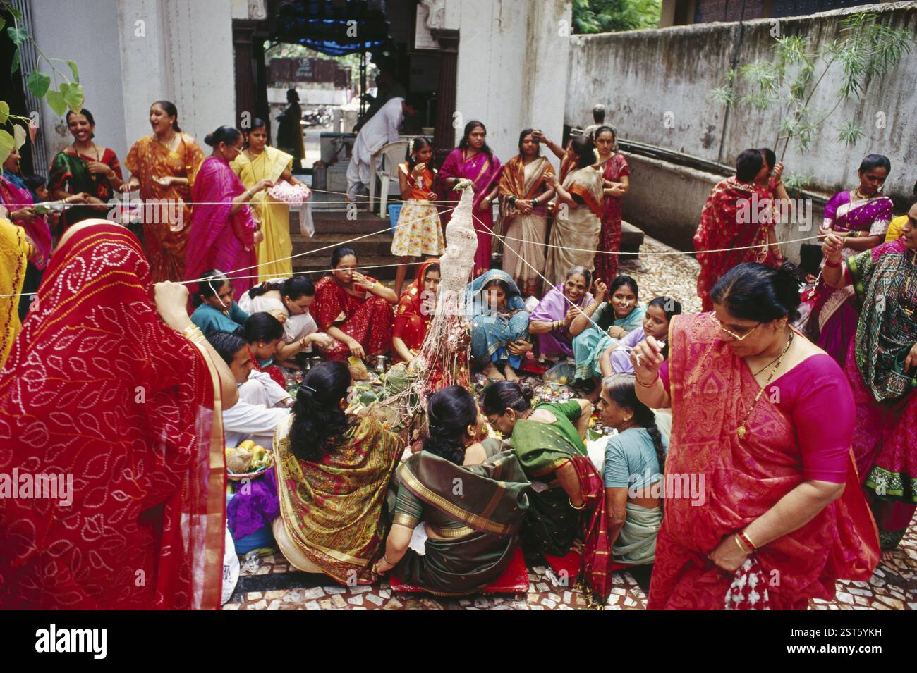 Women Worshiping holding thread, Vat Savitri Festival or Vat Purnima ...