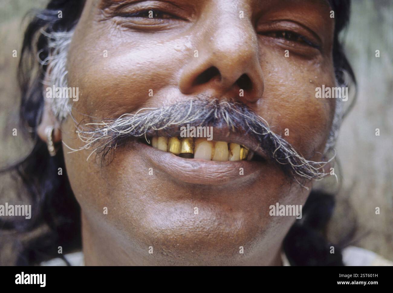 Indian man with gold teeth Stock Photo - Alamy