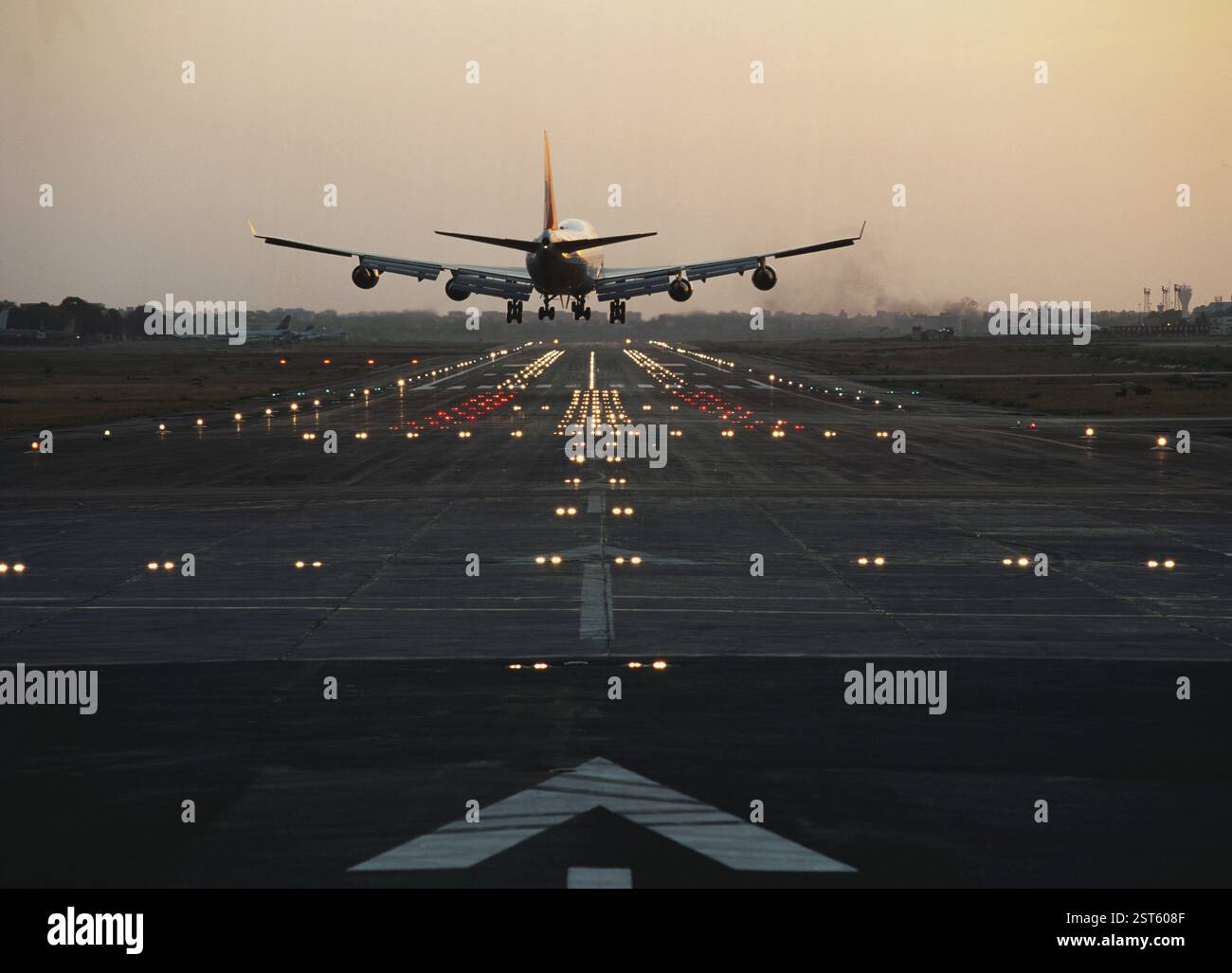 Airplane taking off on runway Stock Photo - Alamy