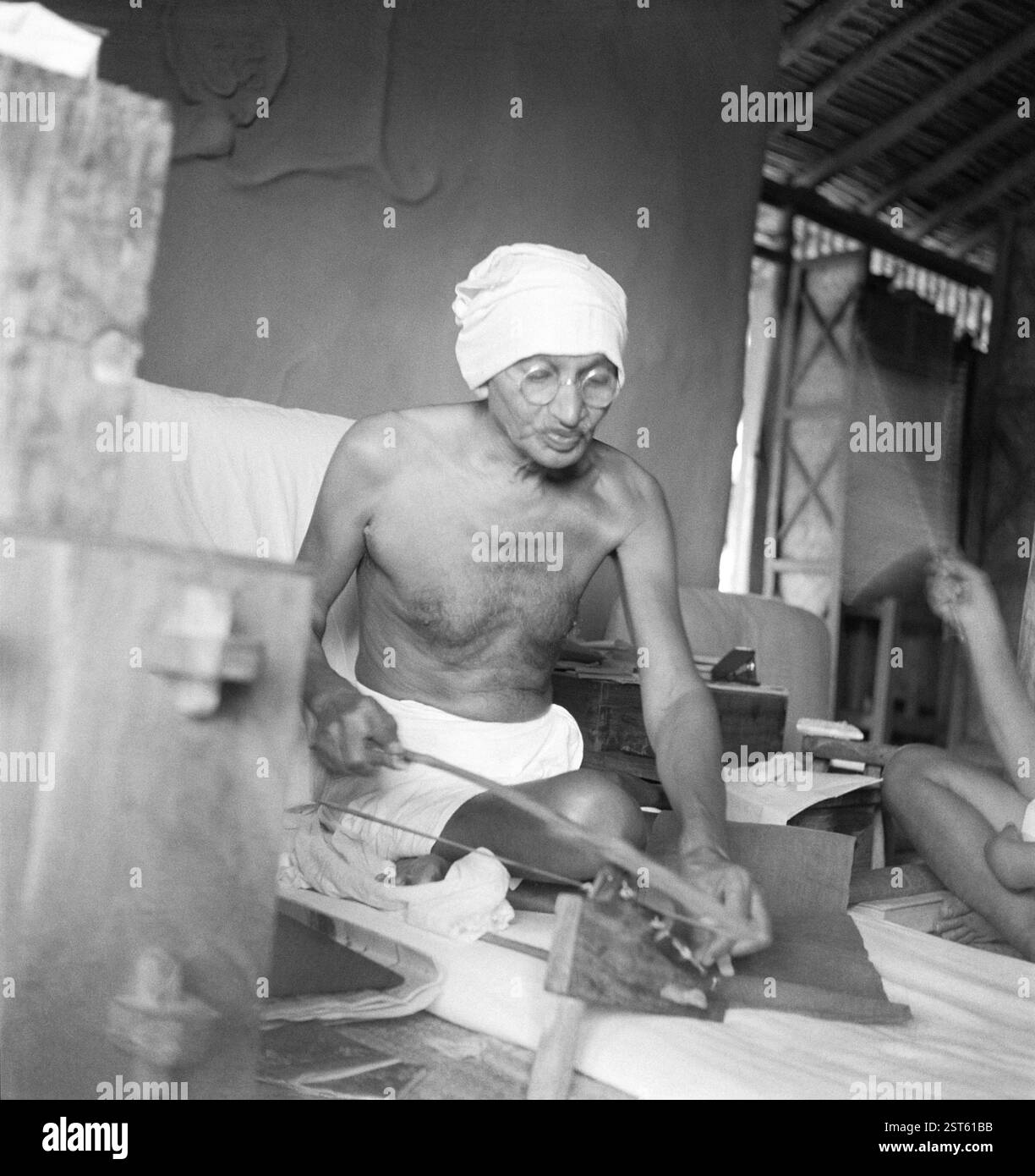 Mahatma Gandhi spinning in his hut at Sevagram Ashram, wardha ...