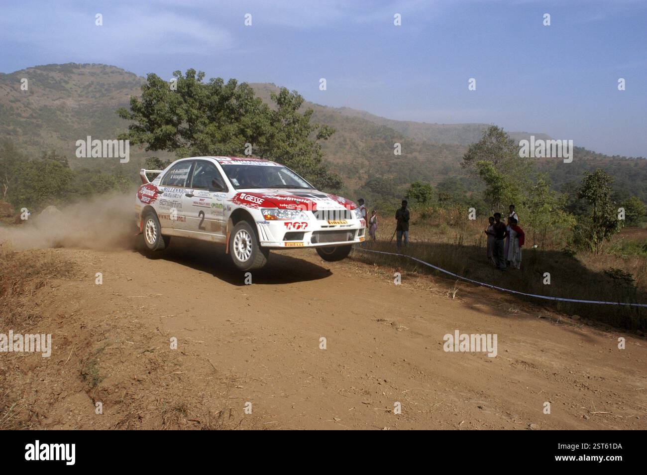 Car passing through the dusty roads at the special stage at Lake City ...