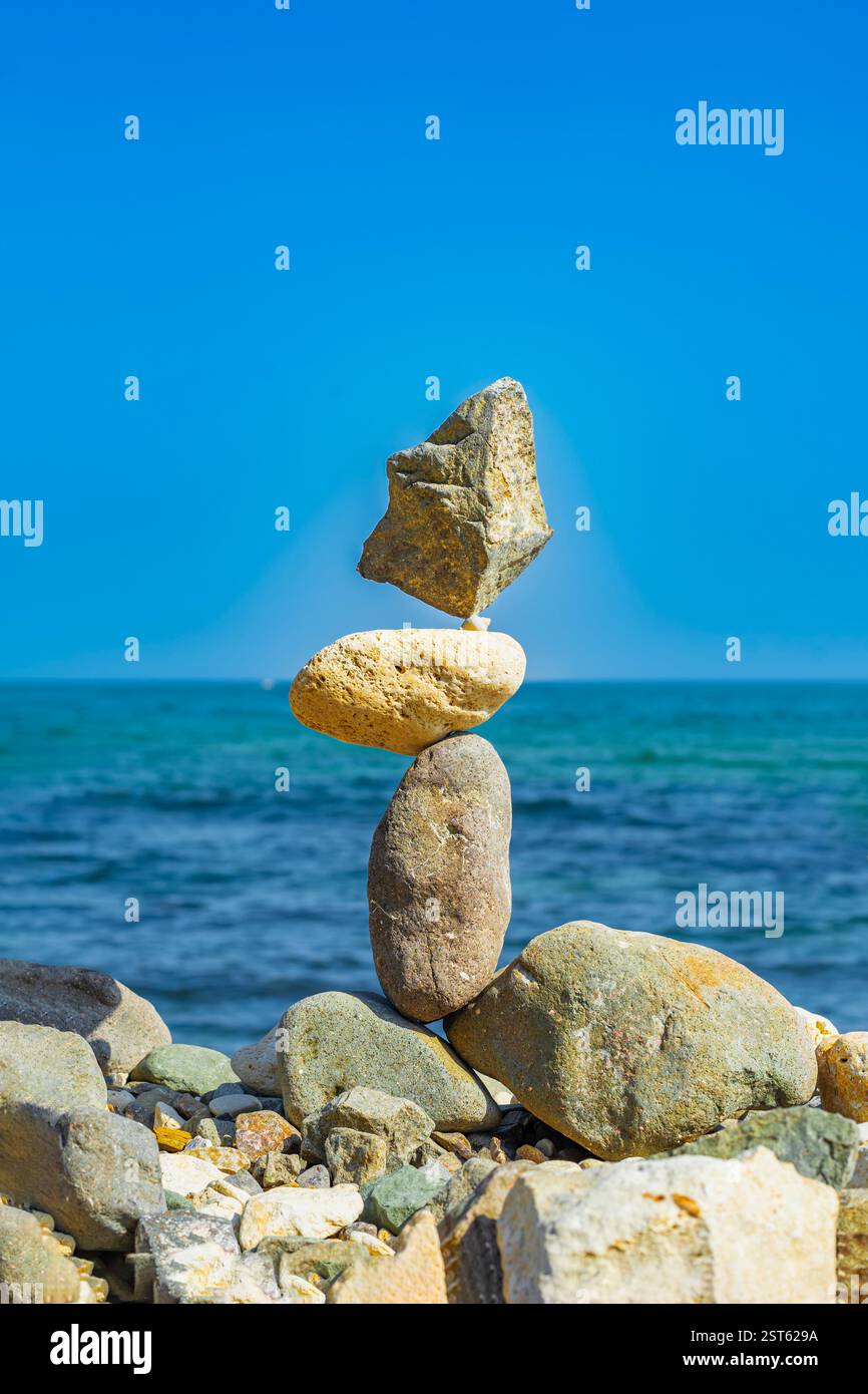 Stone pyramid on pebble beach. Stability, Zen, harmony and balance ...