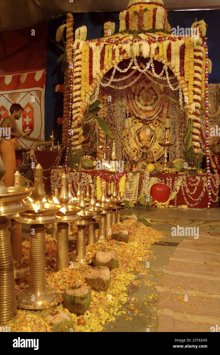 Flower decorations on floor and brass lamps at Ayyappa Pooja, Kerala ...
