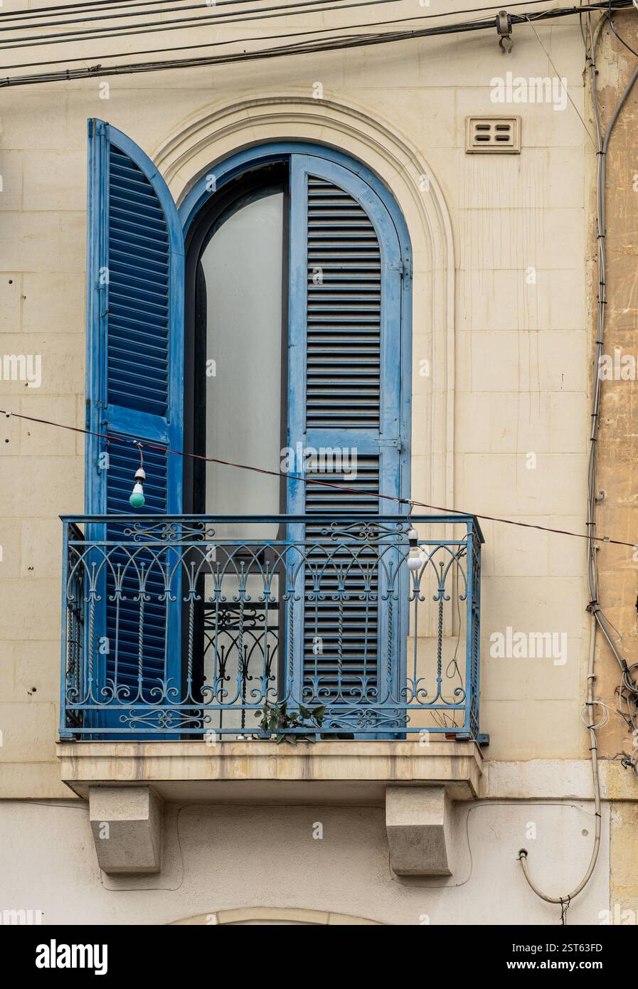 Traditional house detail in Malta. Limestone yellow bricks and colorful ...