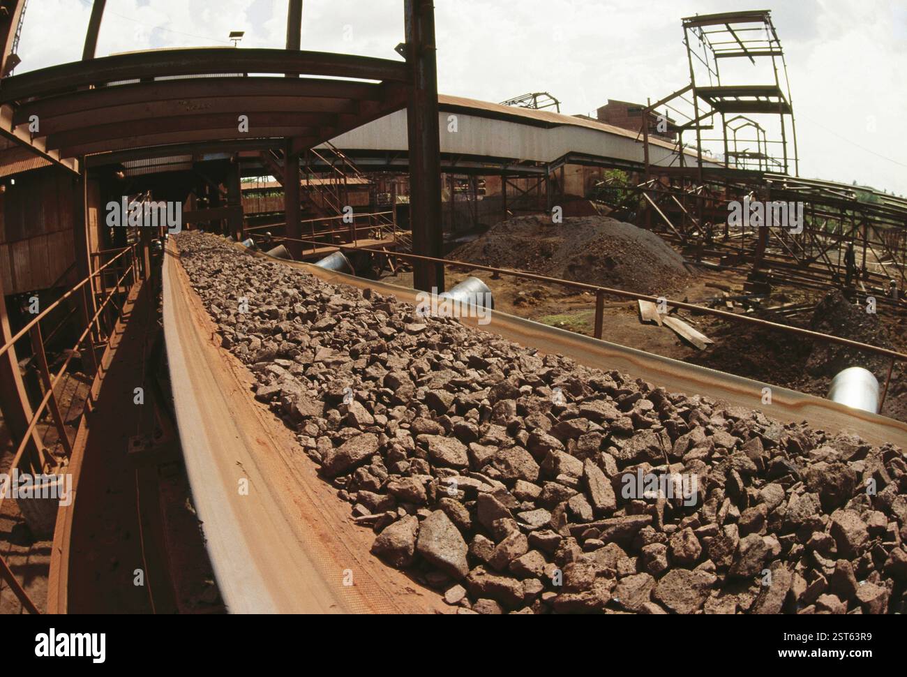 Iron ore on conveyors, goa, india Stock Photo - Alamy