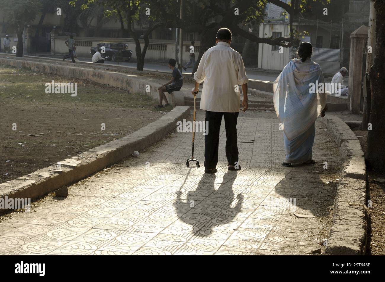 Couple, Old Indian man and woman walking on footpath, Bombay Mumbai ...
