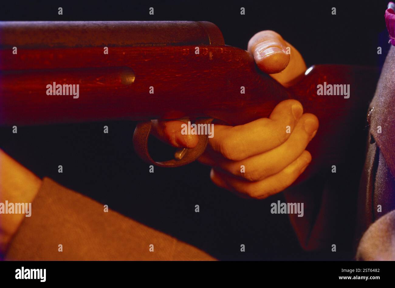 Military soldier holding gun and pulling trigger Stock Photo - Alamy