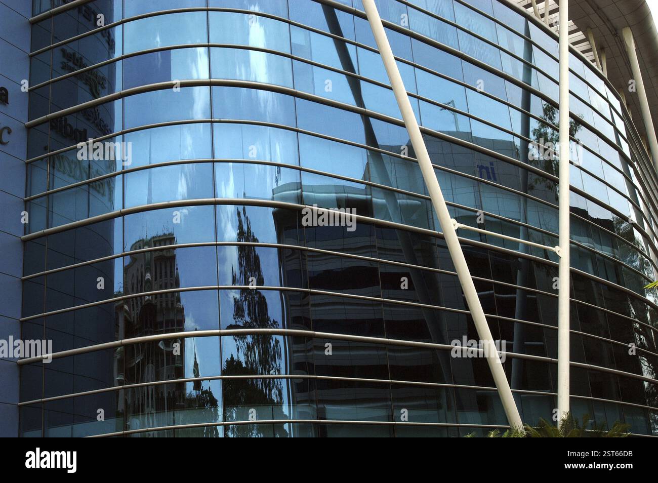 Reflection of a building on RMZ Corp, RMZ Titanium building a modern ...