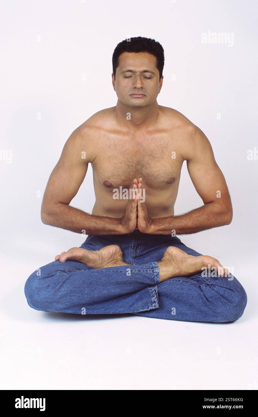 Indian man practising yoga hi-res stock photography and images - Alamy