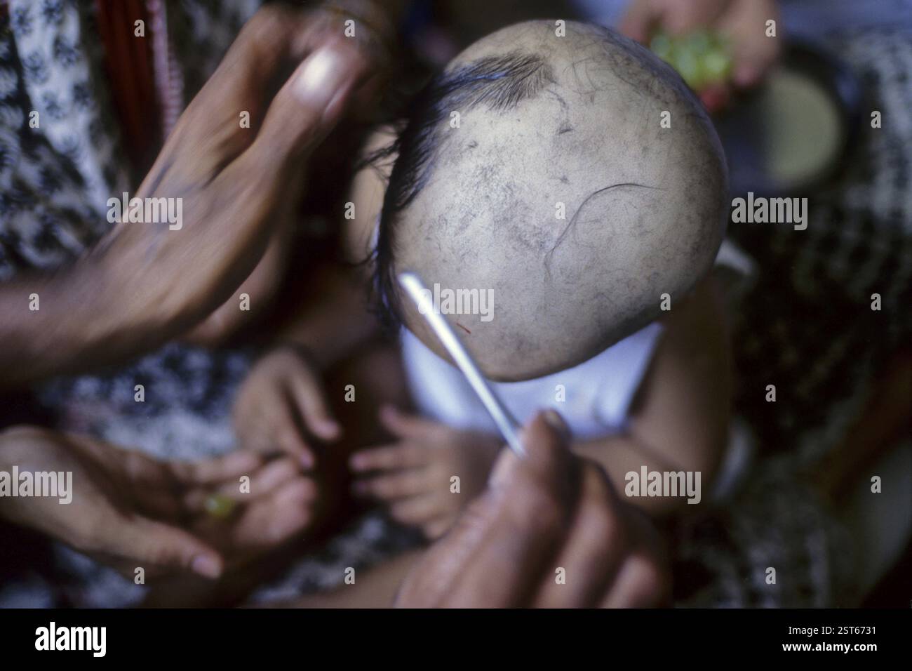Mundan head shaving ceremony of Indian child MR#152 Stock Photo - Alamy