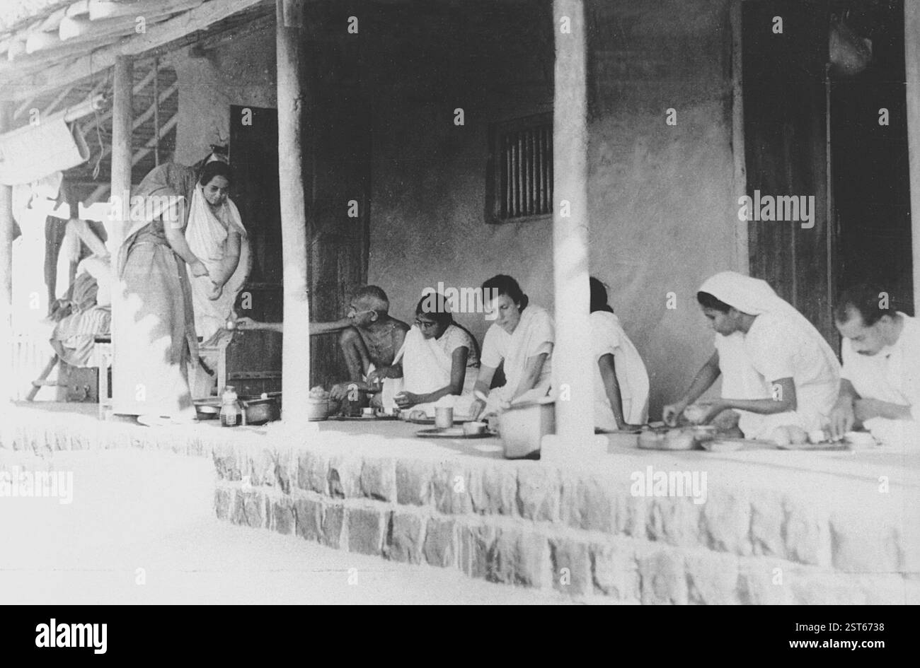 Mahatma Gandhi and coashramites taking dinner at Sevagram Ashram ...