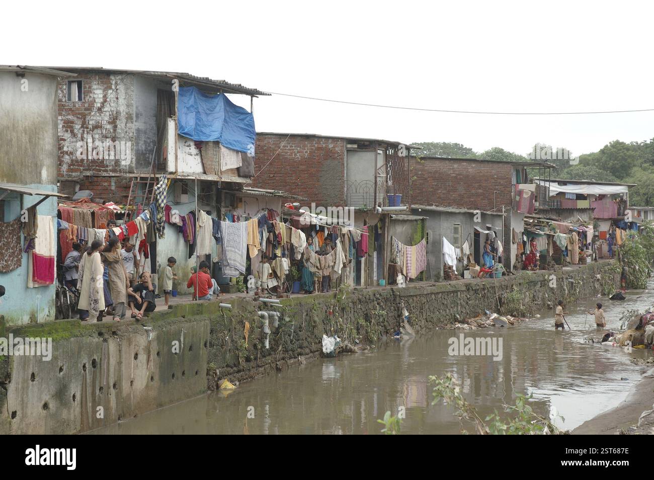A slum area on the bank of Nala near Dnyansadhana College, Thane, India ...