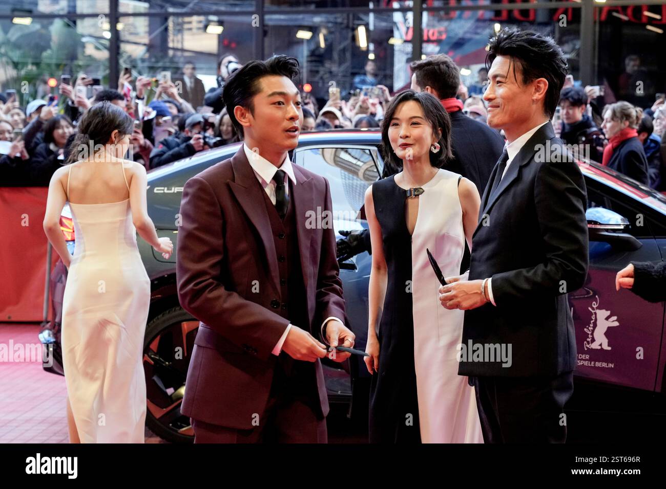 From left: Zhang Youhao, Peng Jing and Geng Le arrive for the red ...