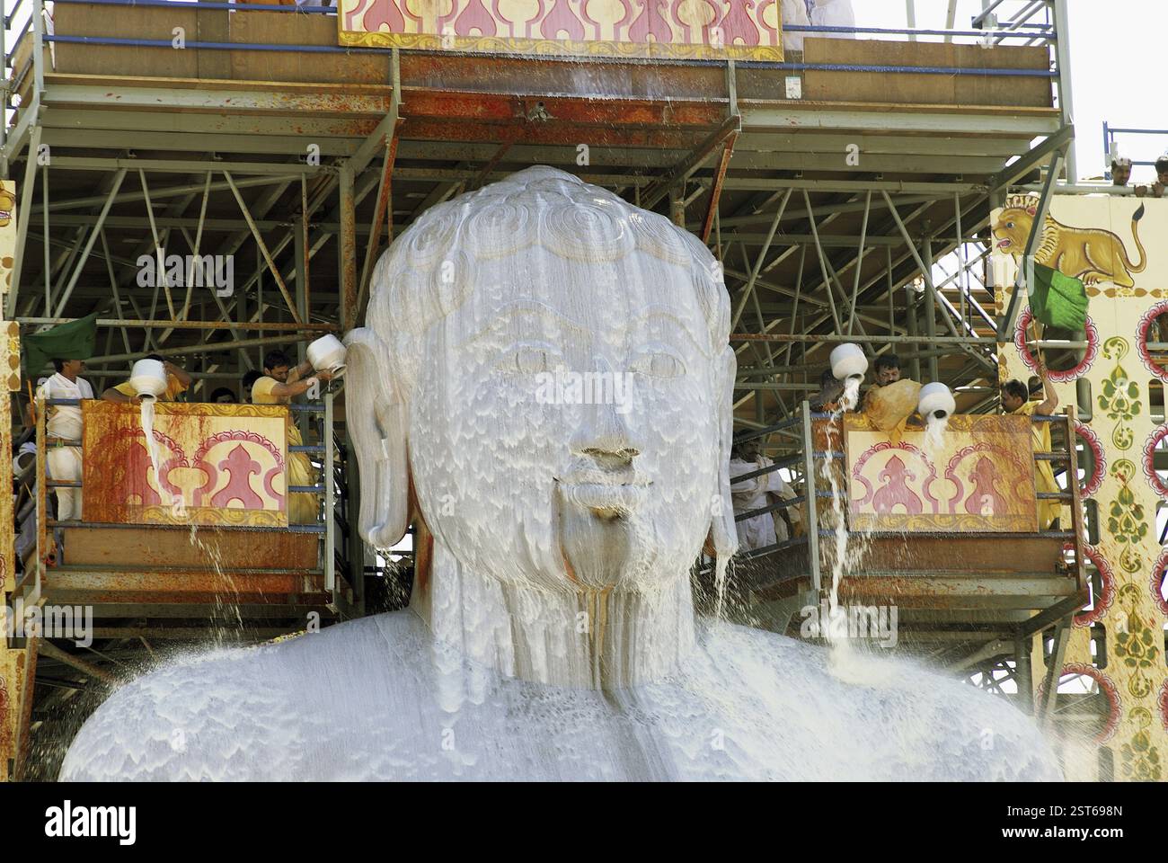 Jain Devotees pouring milk on the head of 58.8 feet monolithic Statue ...