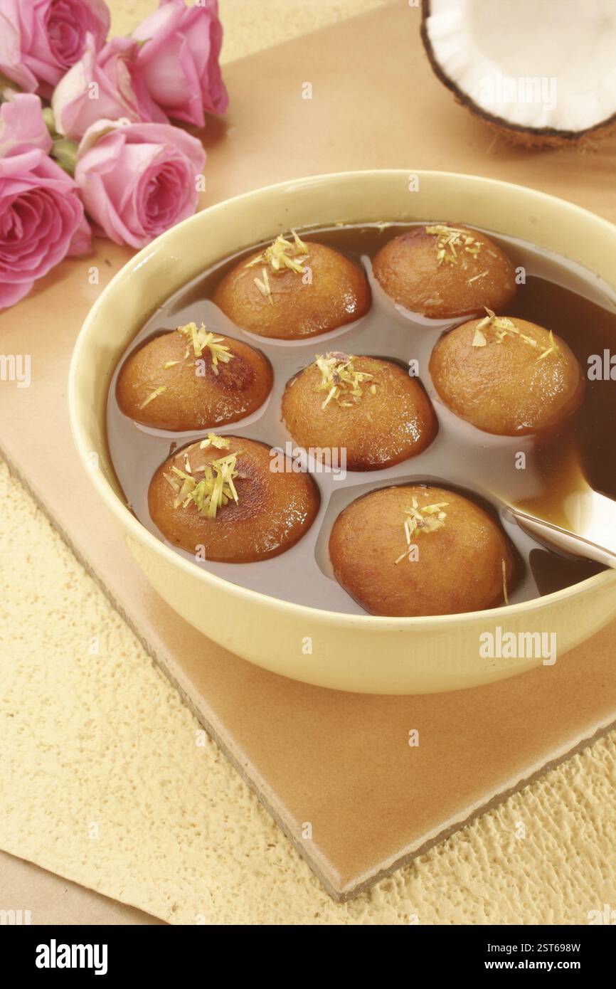 South Asian Indian Food Amrut Fal, deep fried balls in Jaggery syrup ...