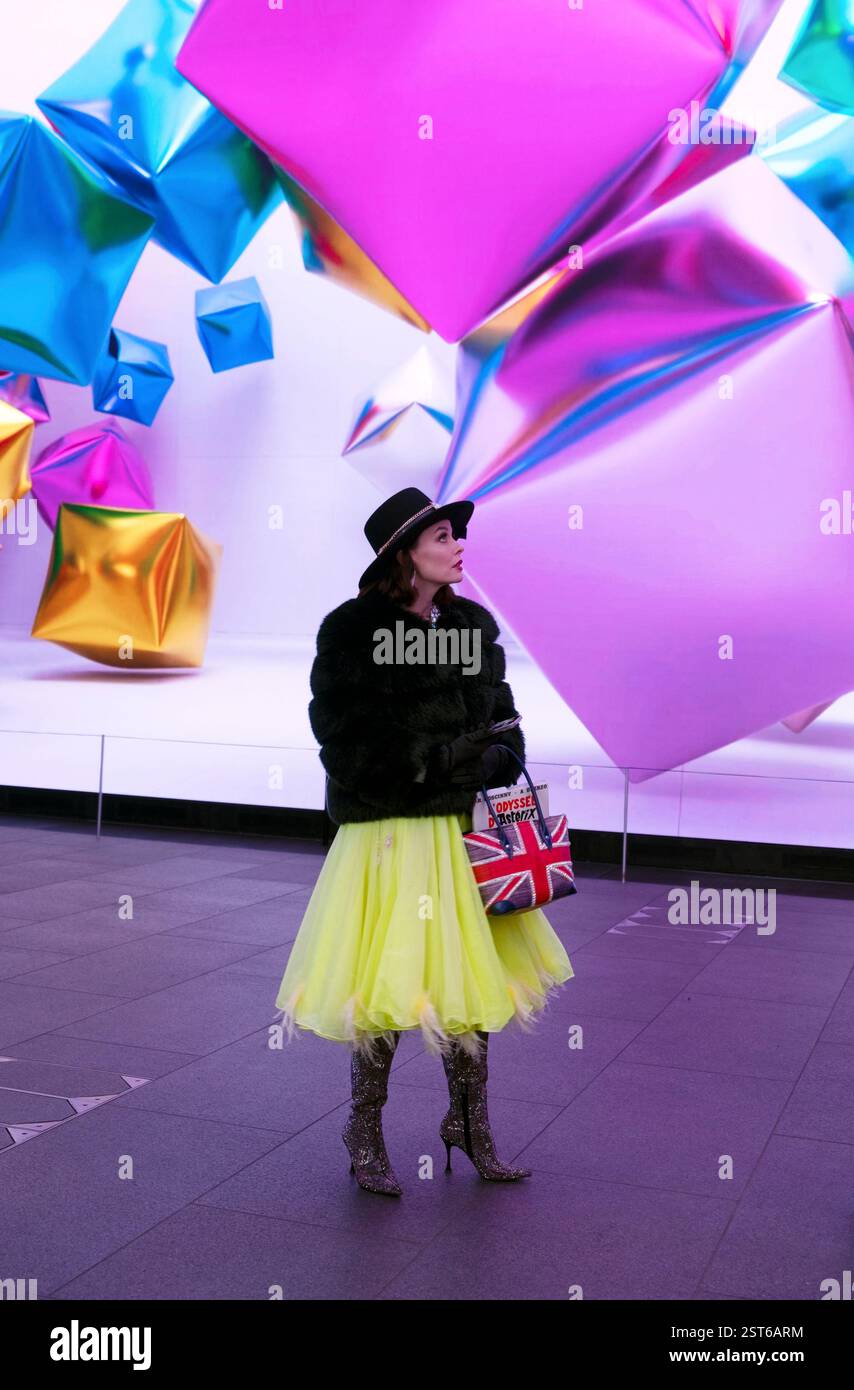 A young woman standing in the Outernet Now Building Charing Cross ...