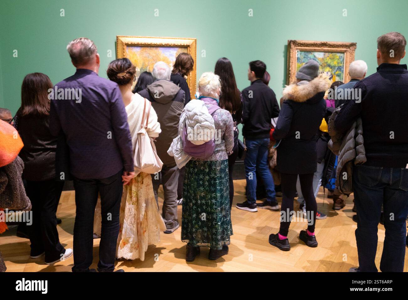 Crowd of visitors people looking at Vincent Van Gogh paintings at ...