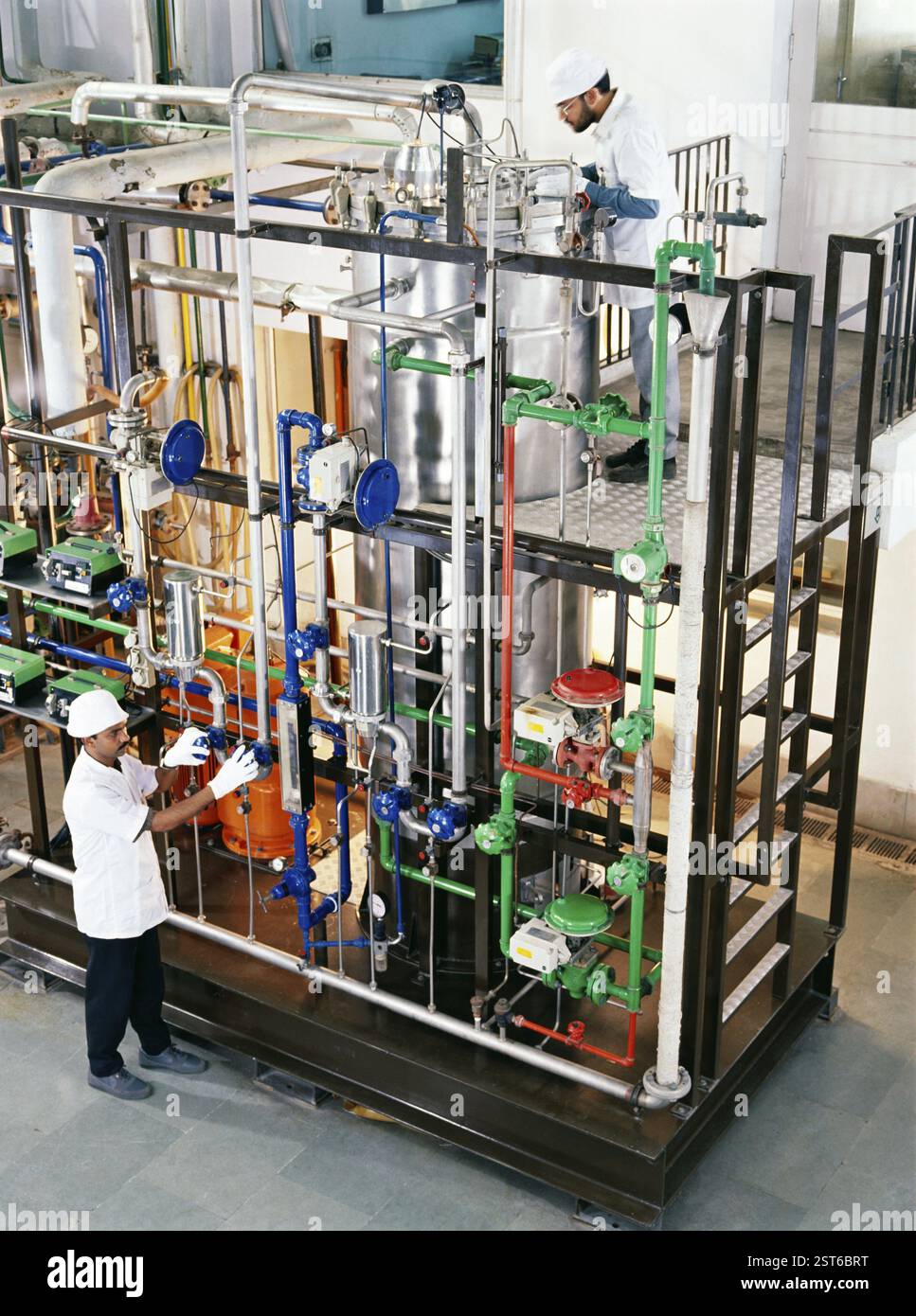 Workers in factory Stock Photo - Alamy