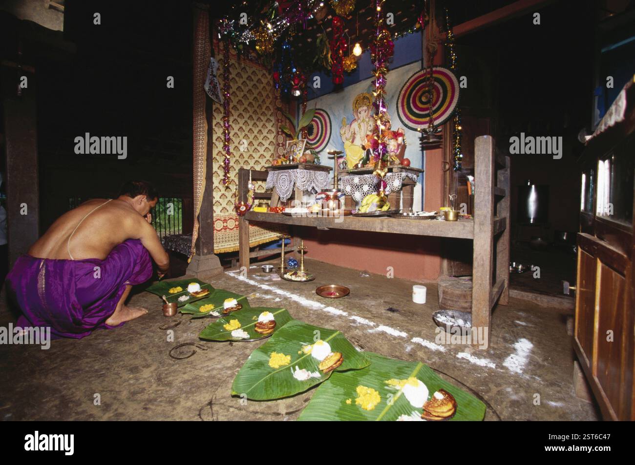 Man offering prasad lord of Ganesh ganpati Festival Elephant head Lord ...