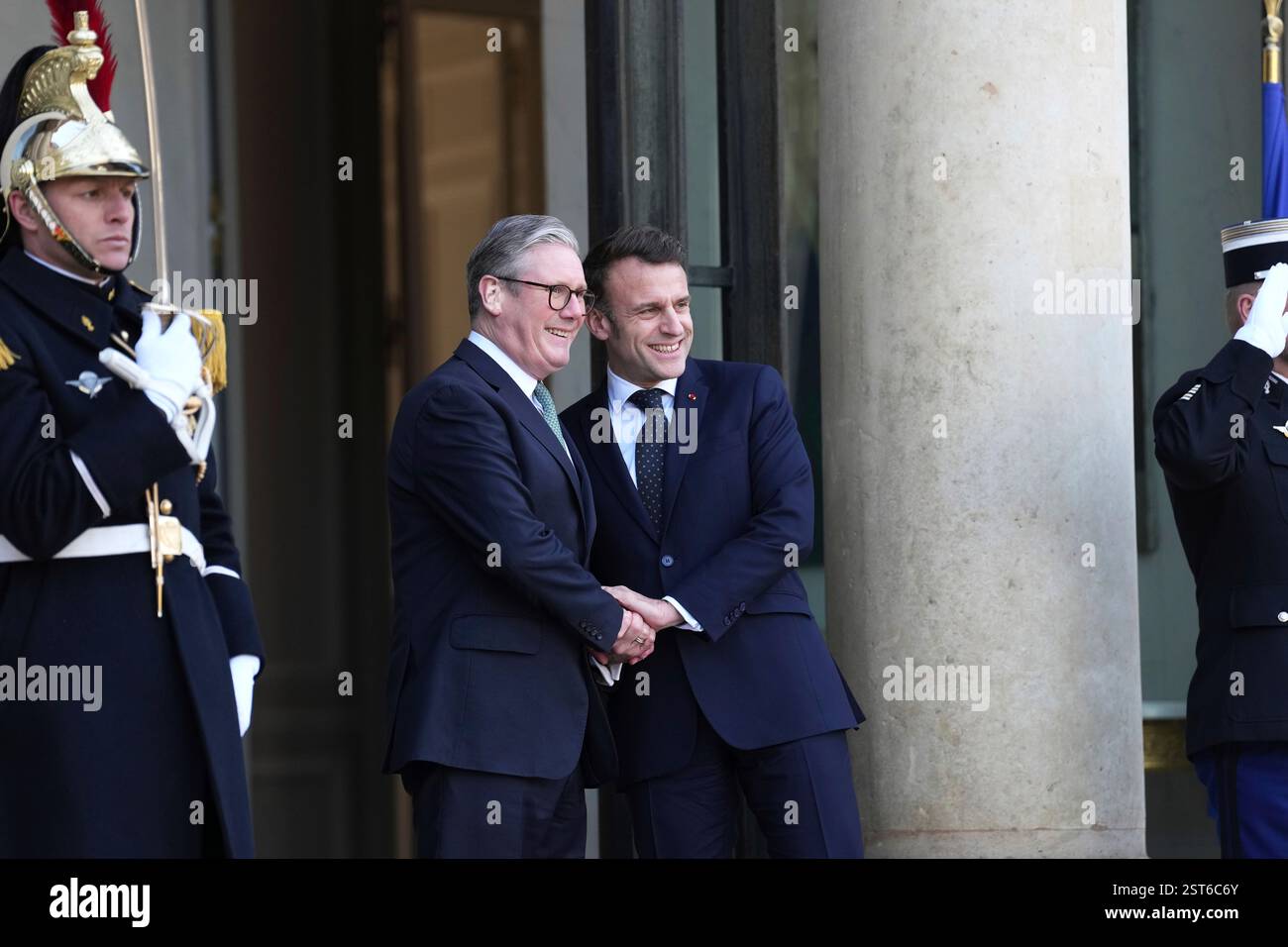 French President Emmanuel Macron, right, greets Britain's Prime ...