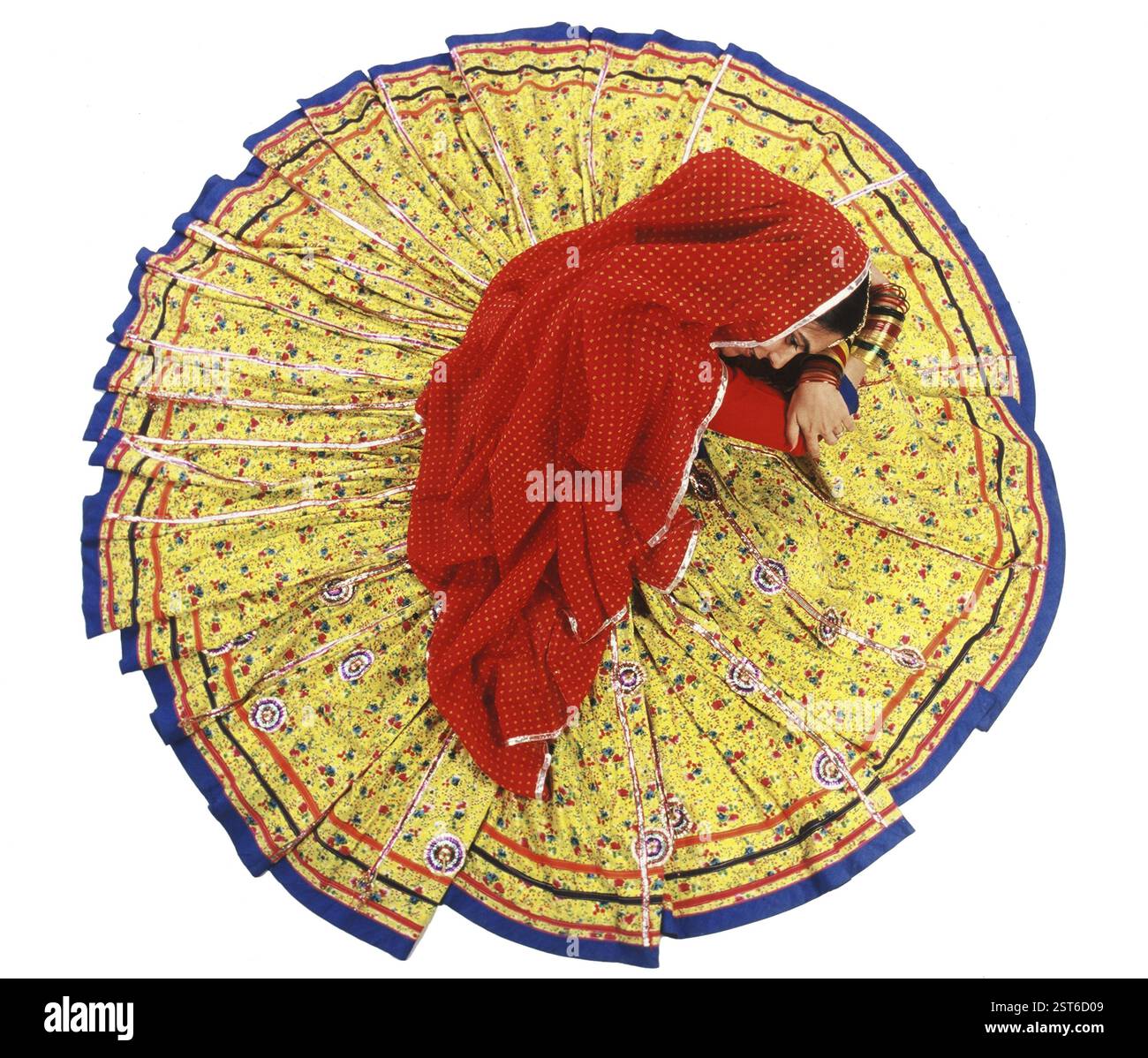 Rajasthani Woman in circular round dress in yellow and red colour ...