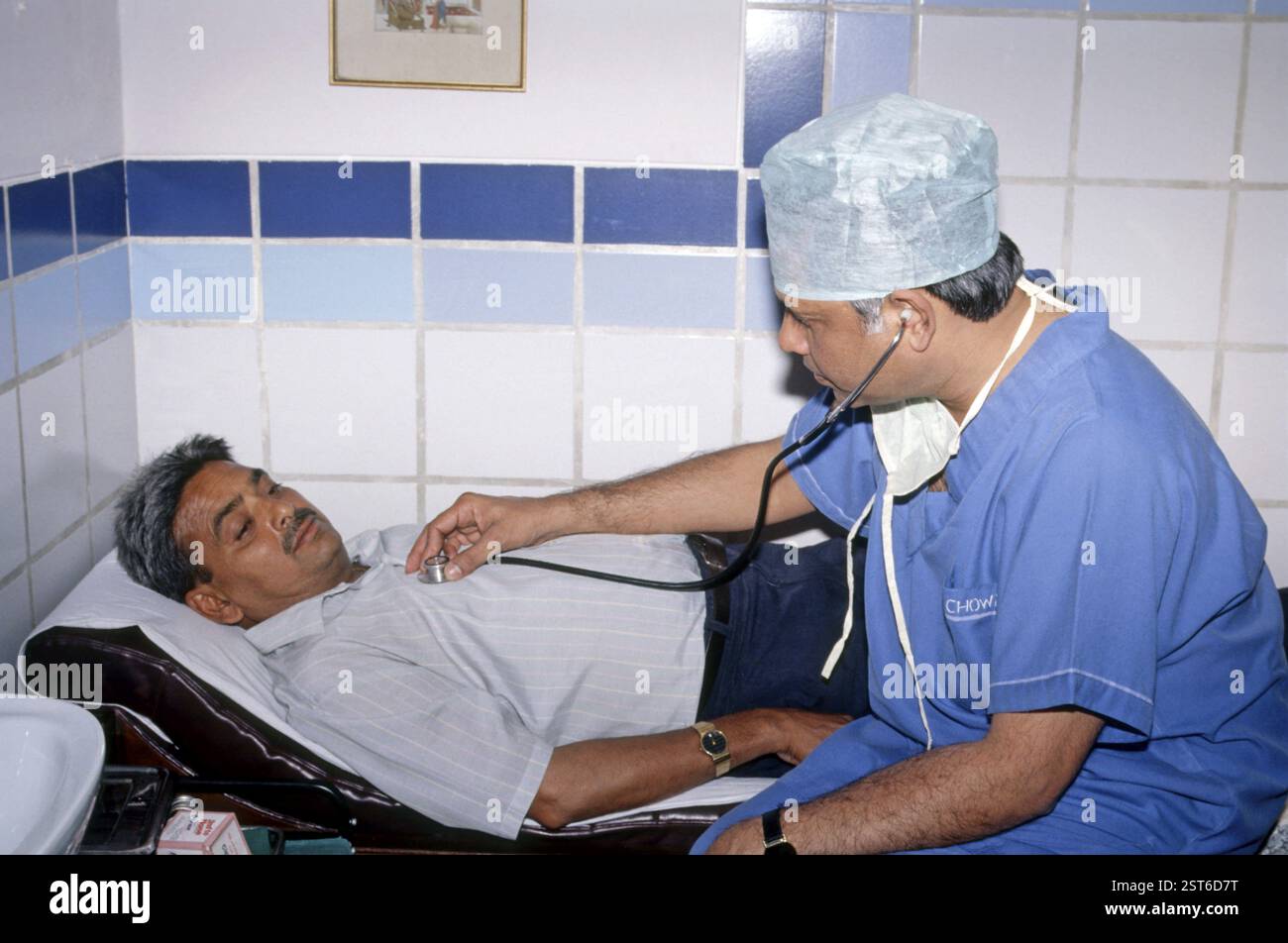Doctor checking his patient, india Stock Photo - Alamy