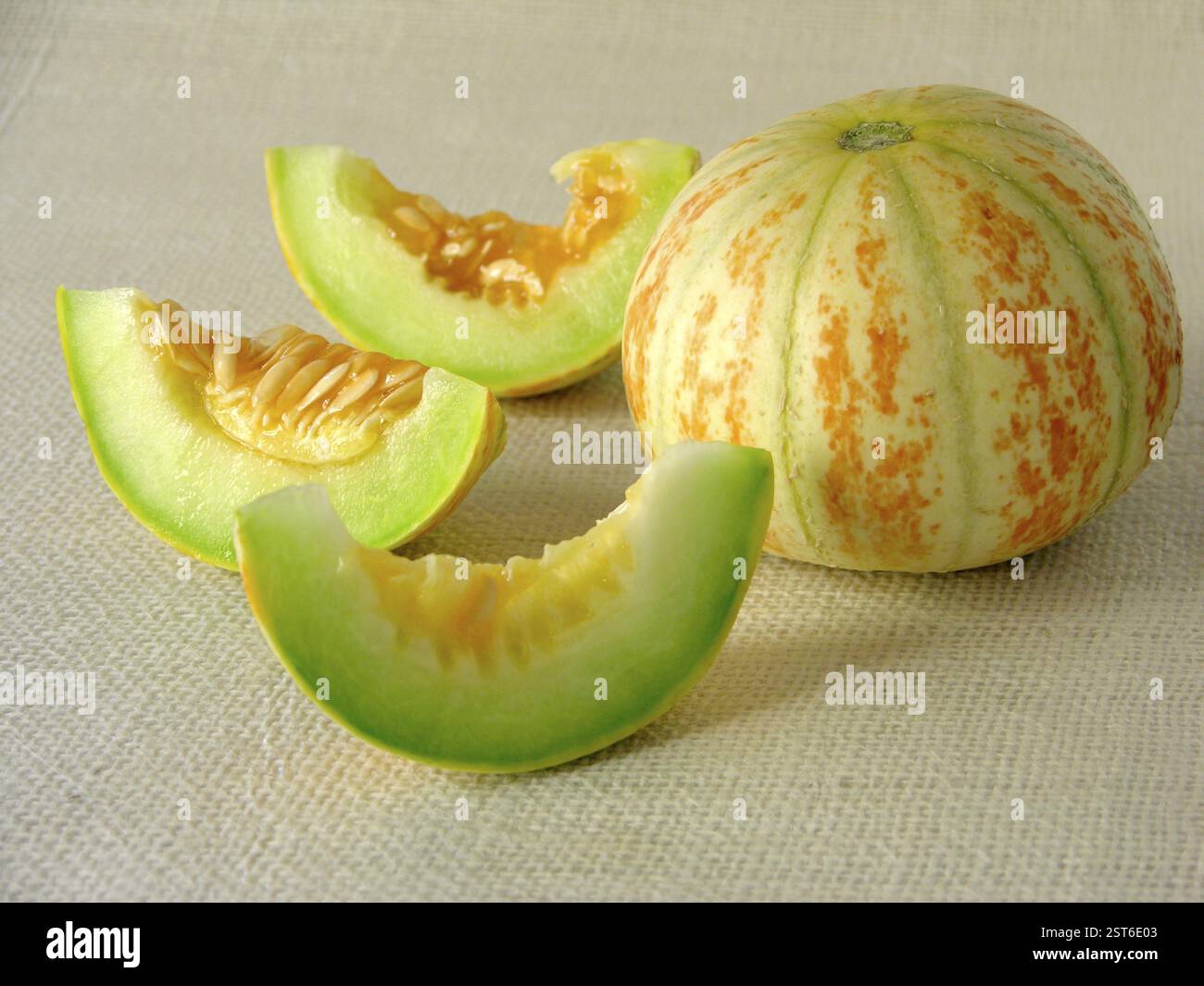 Two sweet melon, fruit food juicy tasty round circular table top studio ...