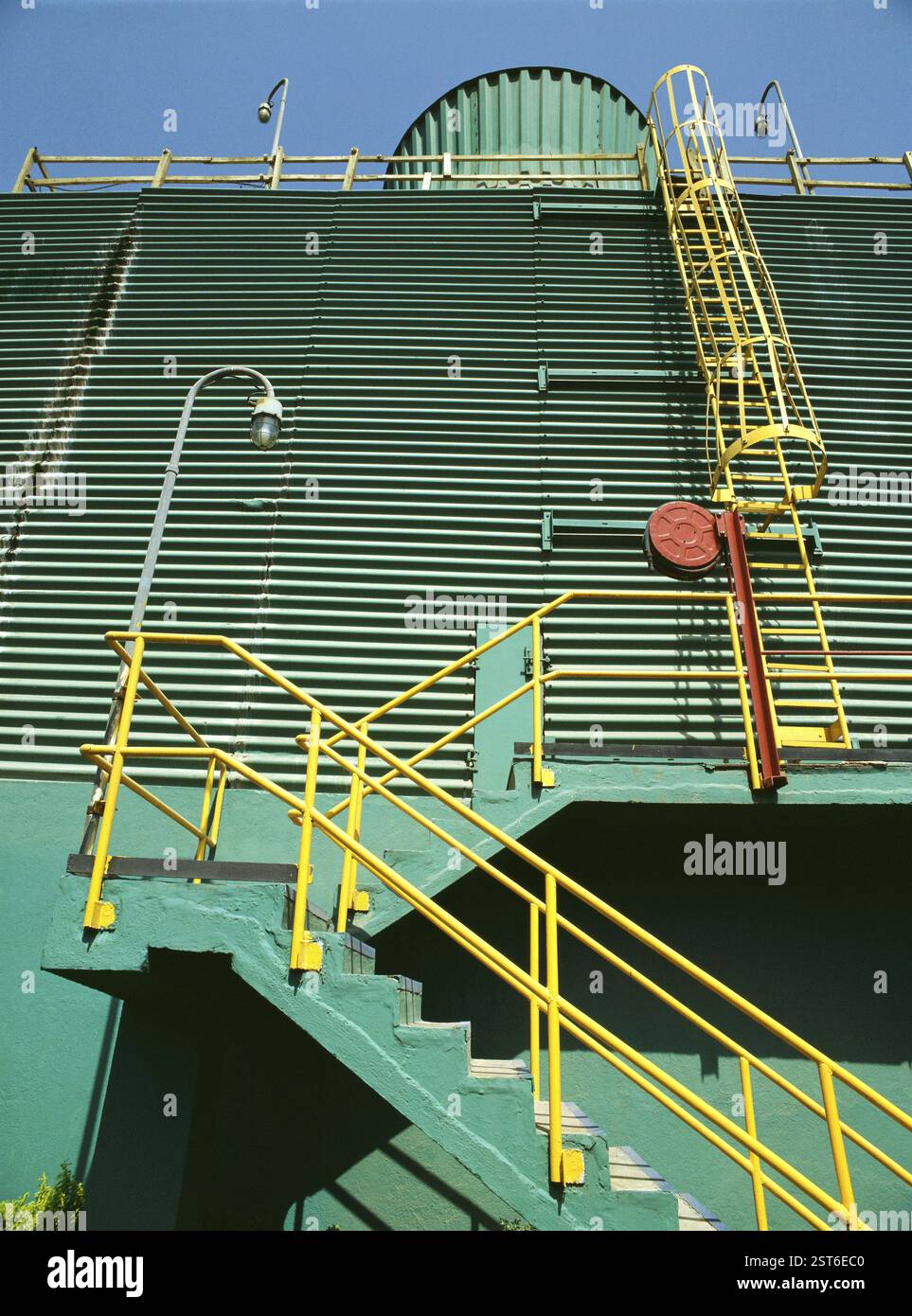 Metal staircase outside of factory Stock Photo - Alamy