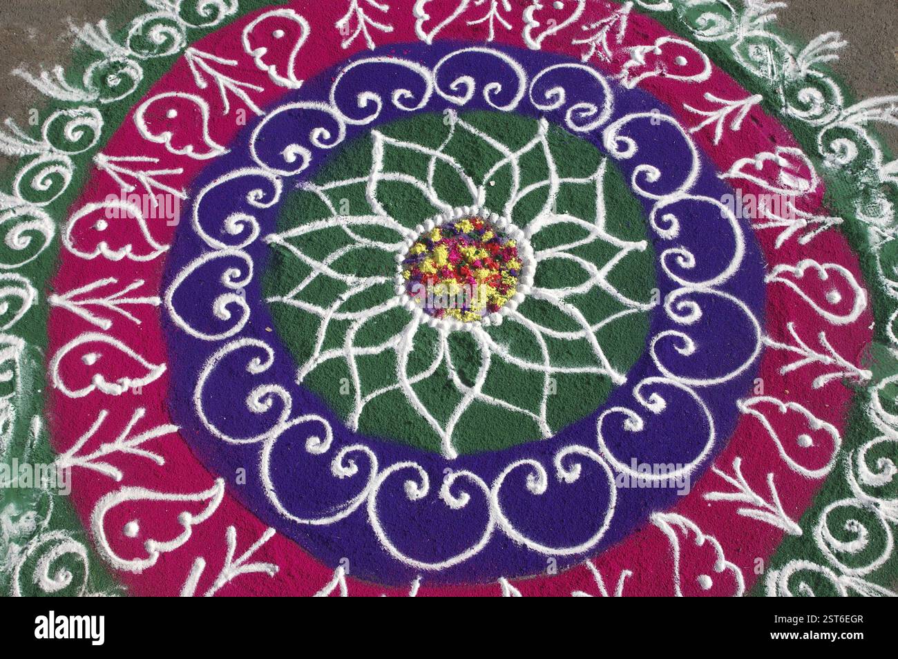Rangoli, Indian art of drawing with colors, Design drawn on the ground ...