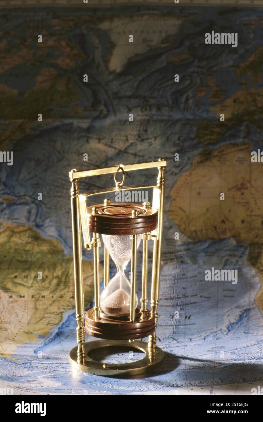 Concept, sand clock on map Stock Photo - Alamy