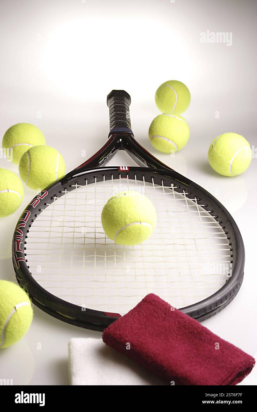 Tennis balls green eight with one racket and two wrist bands Stock ...