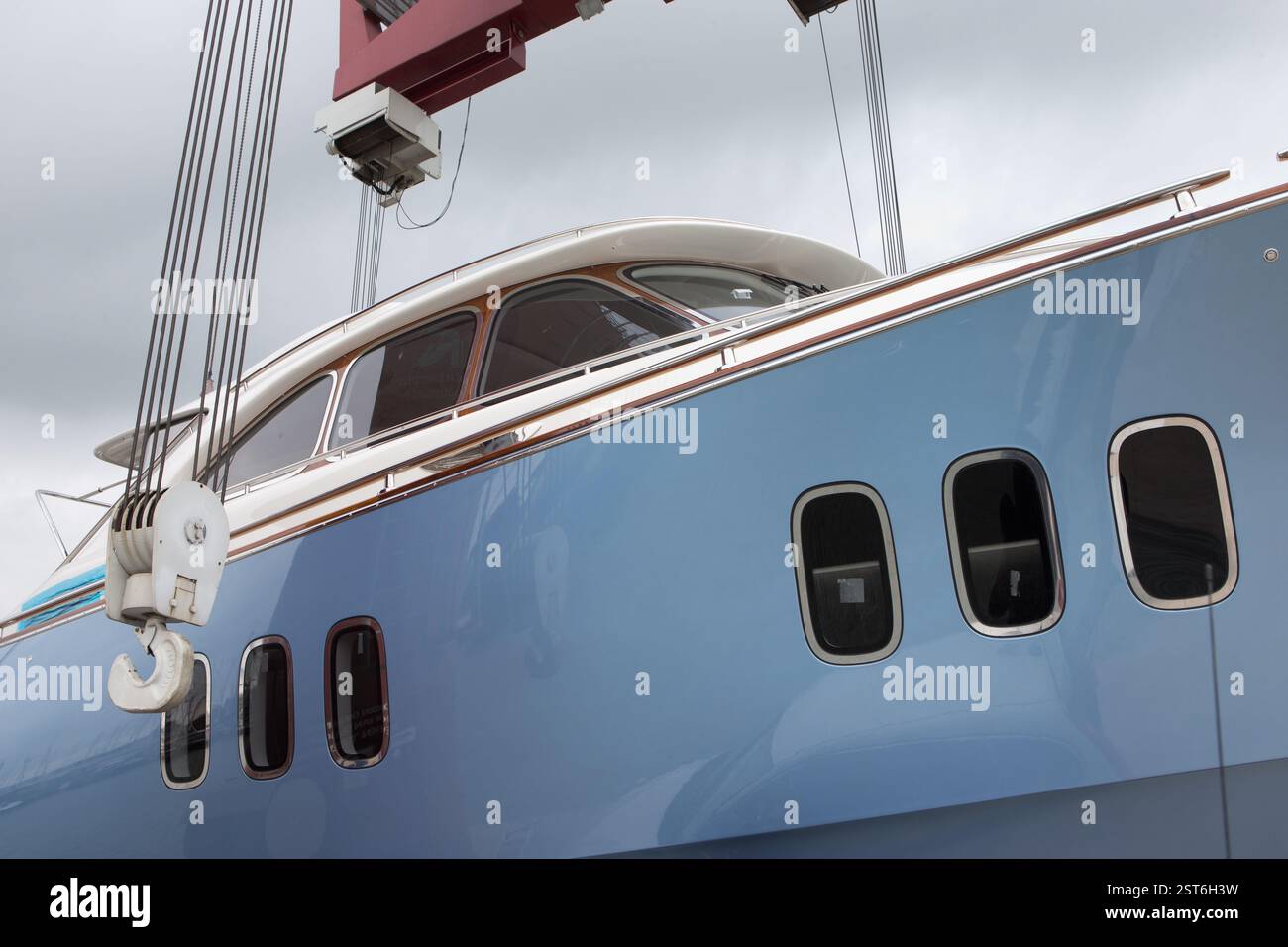 At the shipyard. Blue yacht ready for launch at the yard. Shipbuilding ...