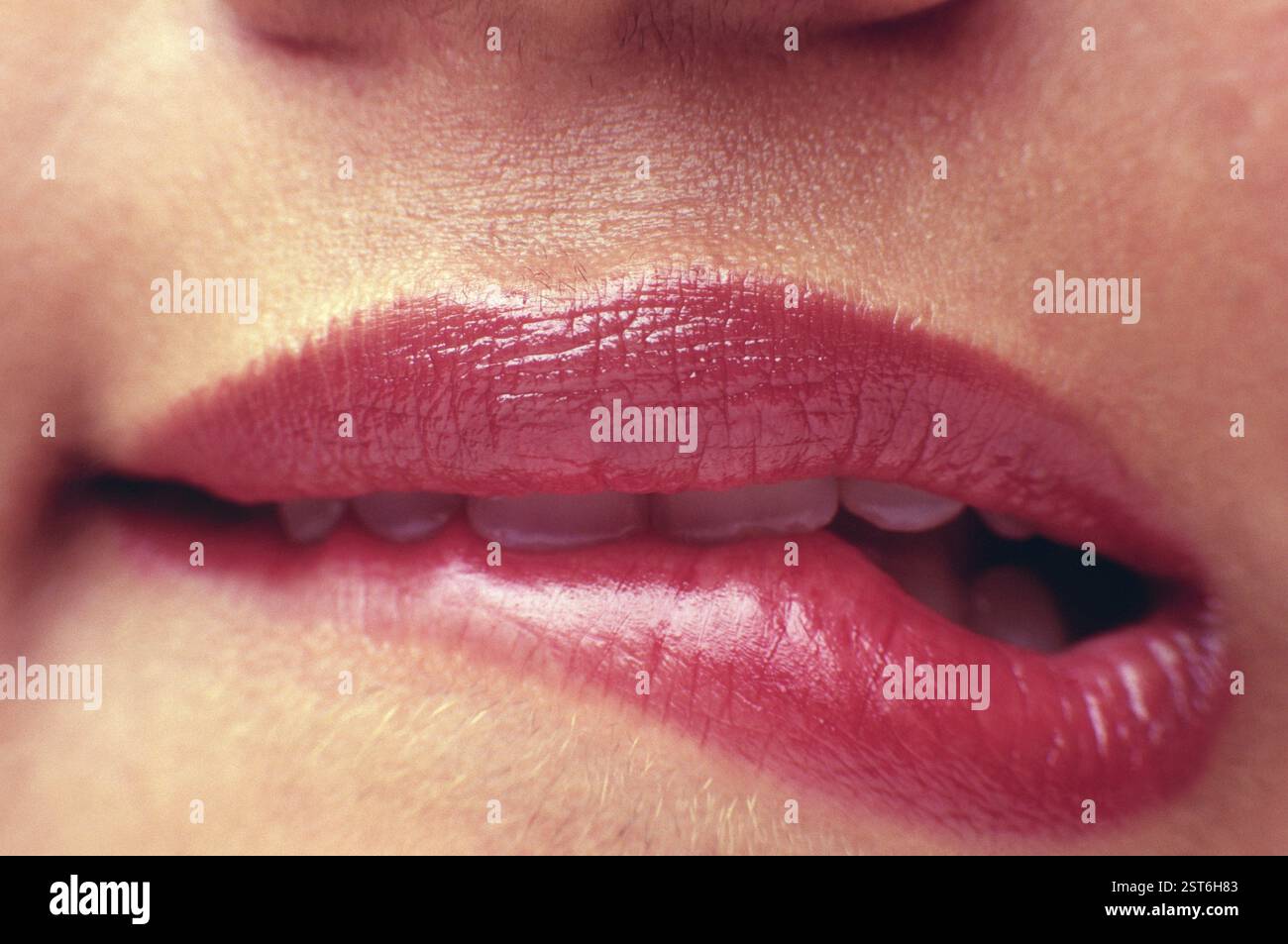 Woman biting lip MR#234 Stock Photo - Alamy