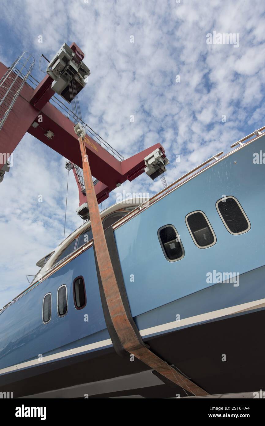 At the shipyard. Blue yacht ready for launch at the yard. Shipbuilding ...