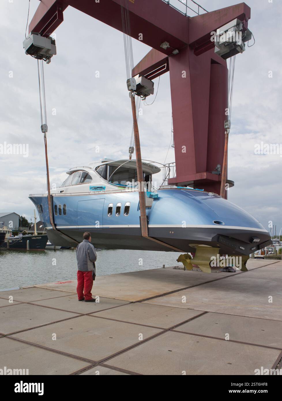 At the shipyard. Blue yacht ready for launch at the yard. Shipbuilding ...