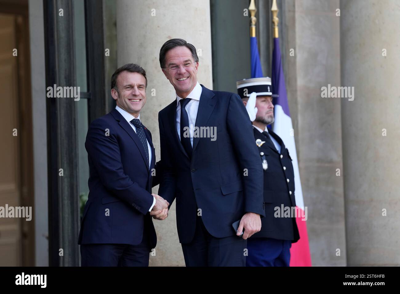 French President Emmanuel Macron, left, greets NATO Secretary General ...