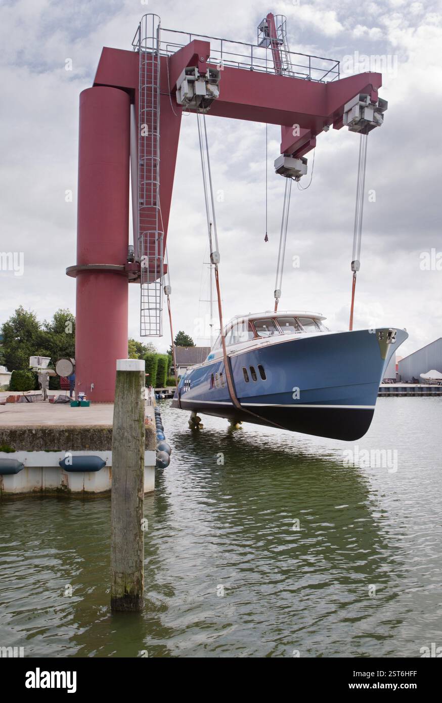At the shipyard. Blue yacht ready for launch at the yard. Shipbuilding ...