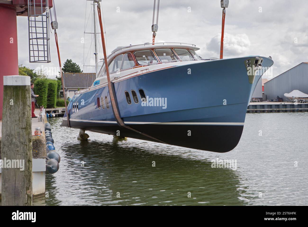 At the shipyard. Blue yacht ready for launch at the yard. Shipbuilding ...
