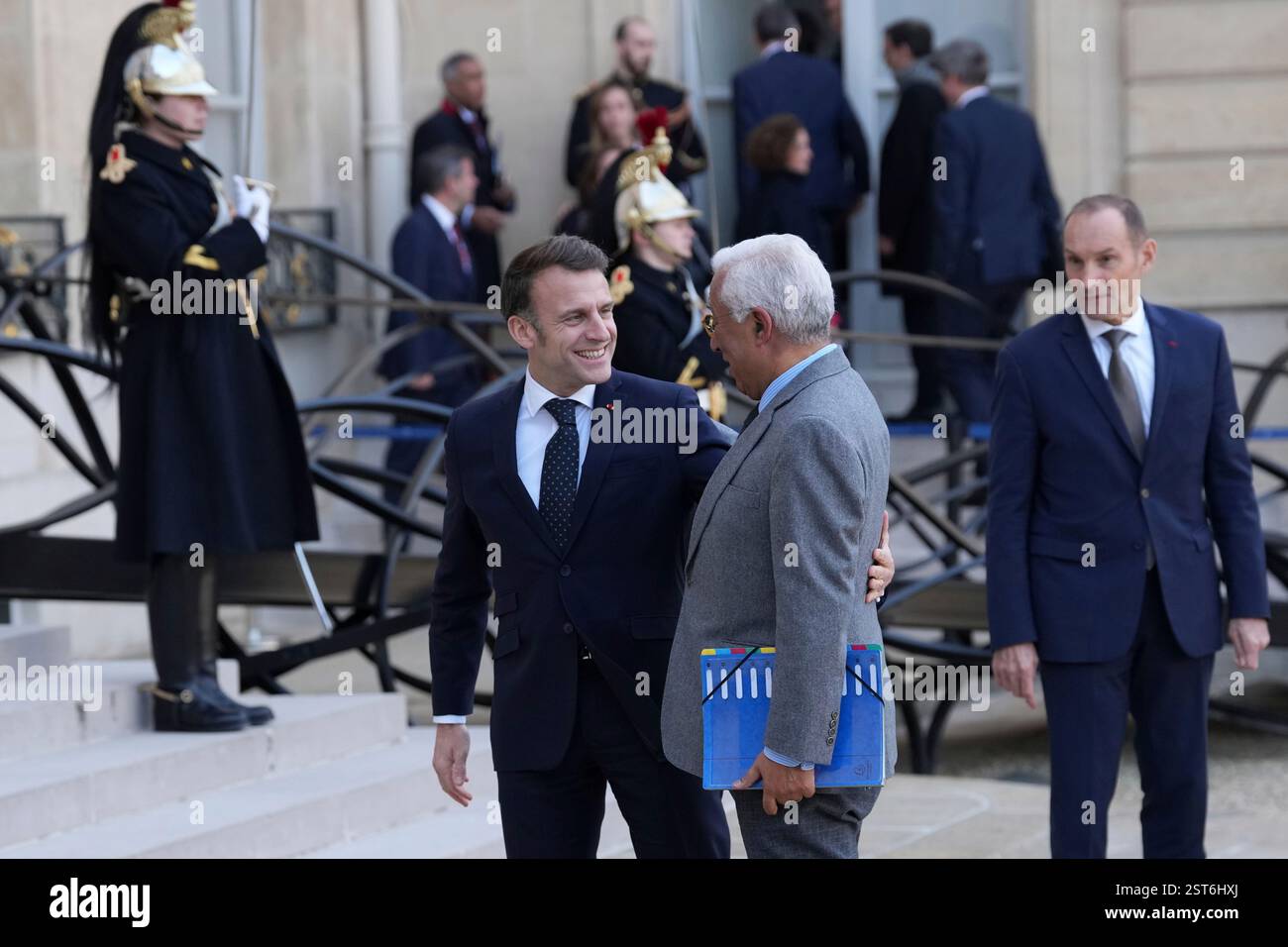 French President Emmanuel Macron, left, greets European Council ...