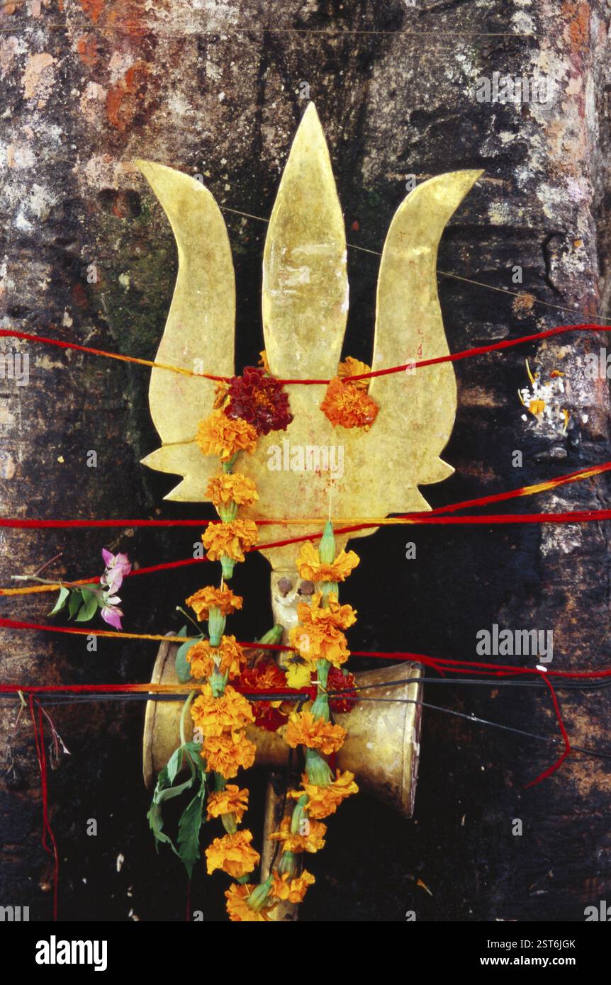 Symbol trishul tied with thread Stock Photo - Alamy