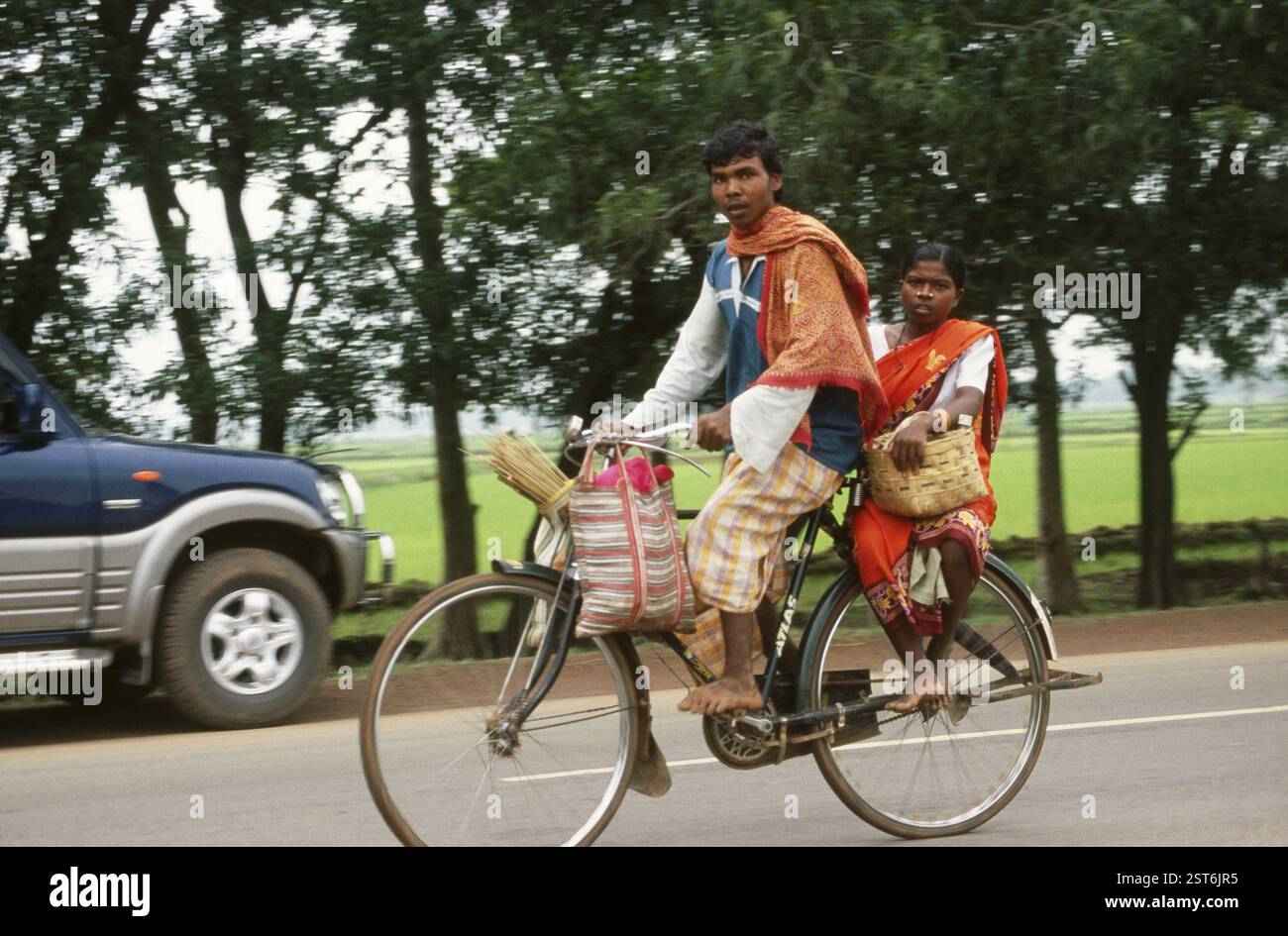 Man and woman riding on cycle Stock Photo - Alamy